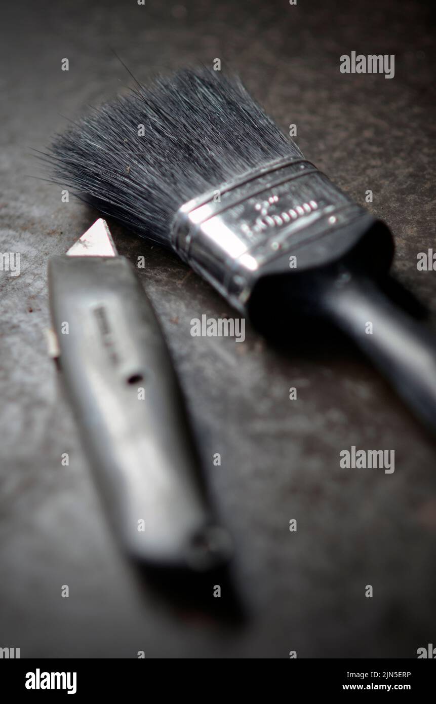 paint brush and craft knife Stock Photo - Alamy