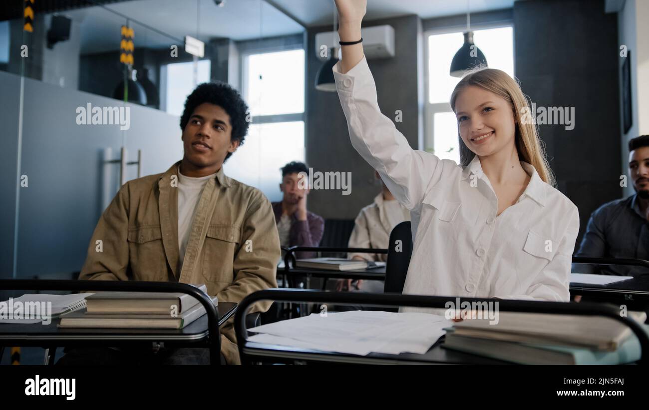 Diverse students classmates attentively listening to interesting ...