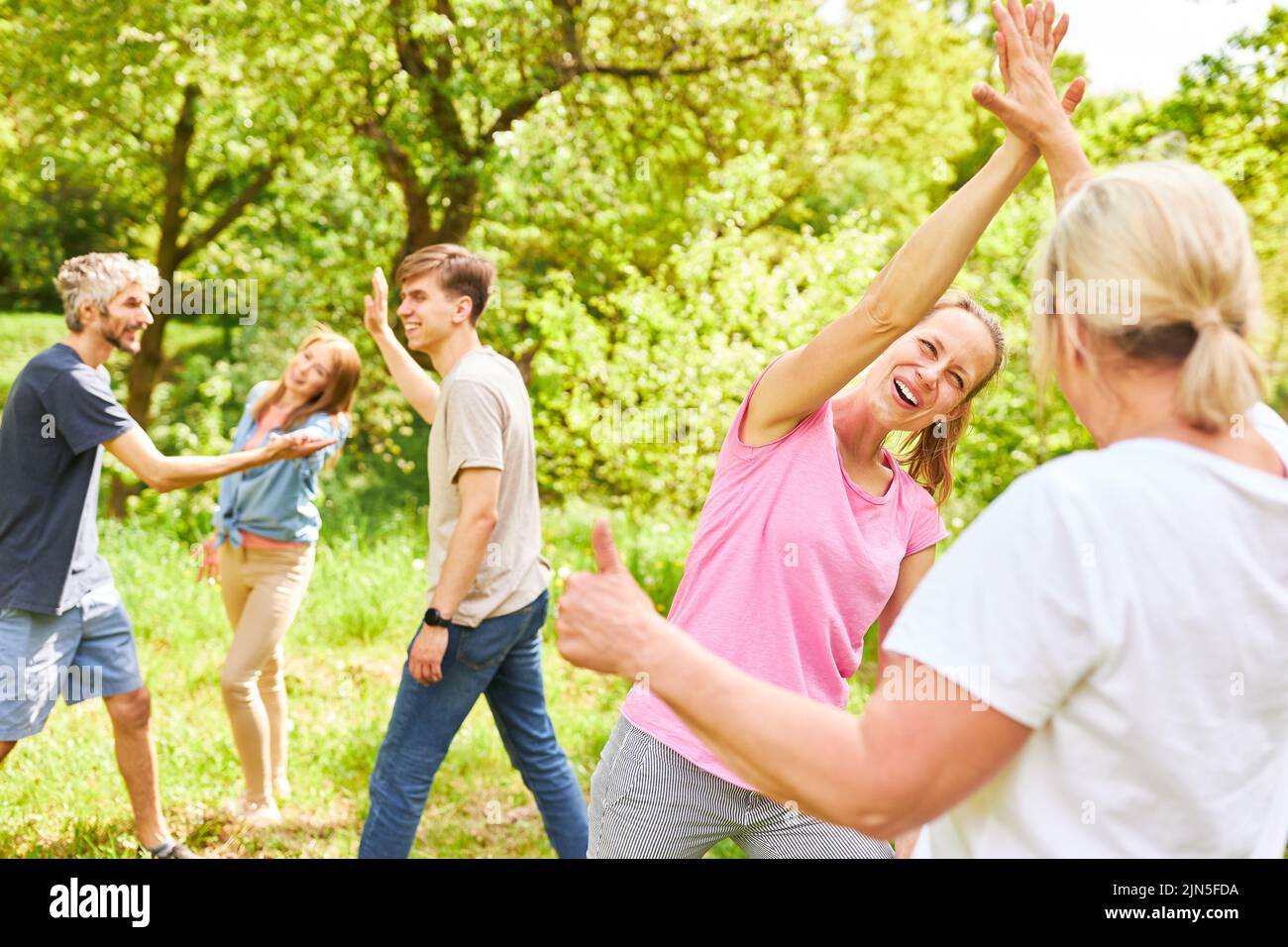 Group of young people rejoices in success in competition in team ...