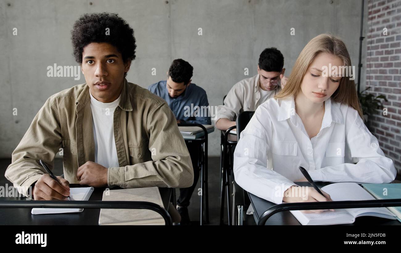 Diverse young group people classmates sitting in classroom at lecture ...