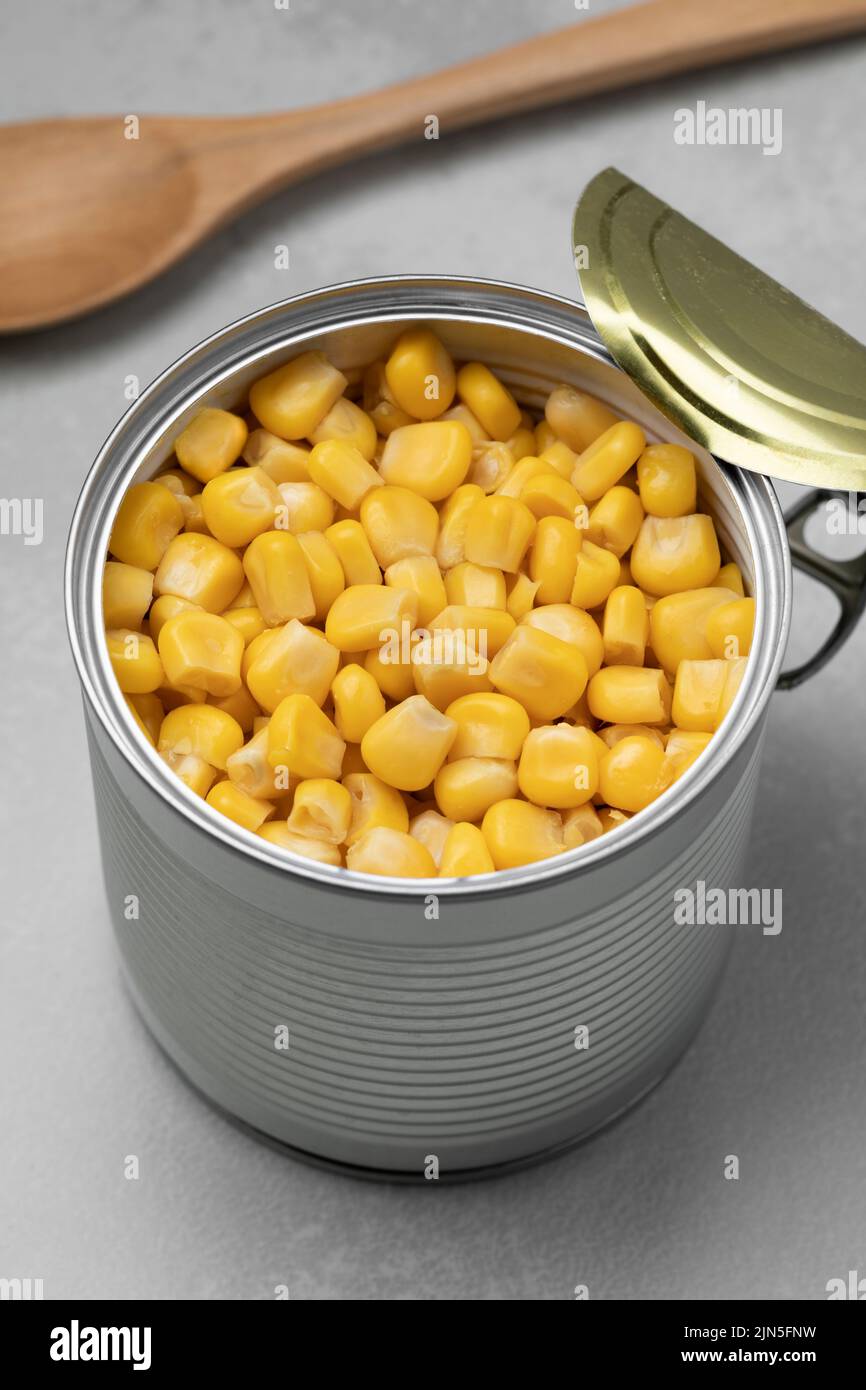 Open tin can with preserved corn close up Stock Photo - Alamy