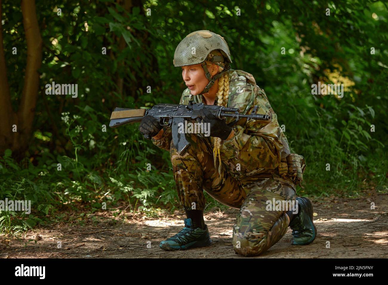 Caucasian Military lady woman in tactical gear posing for photo at ...