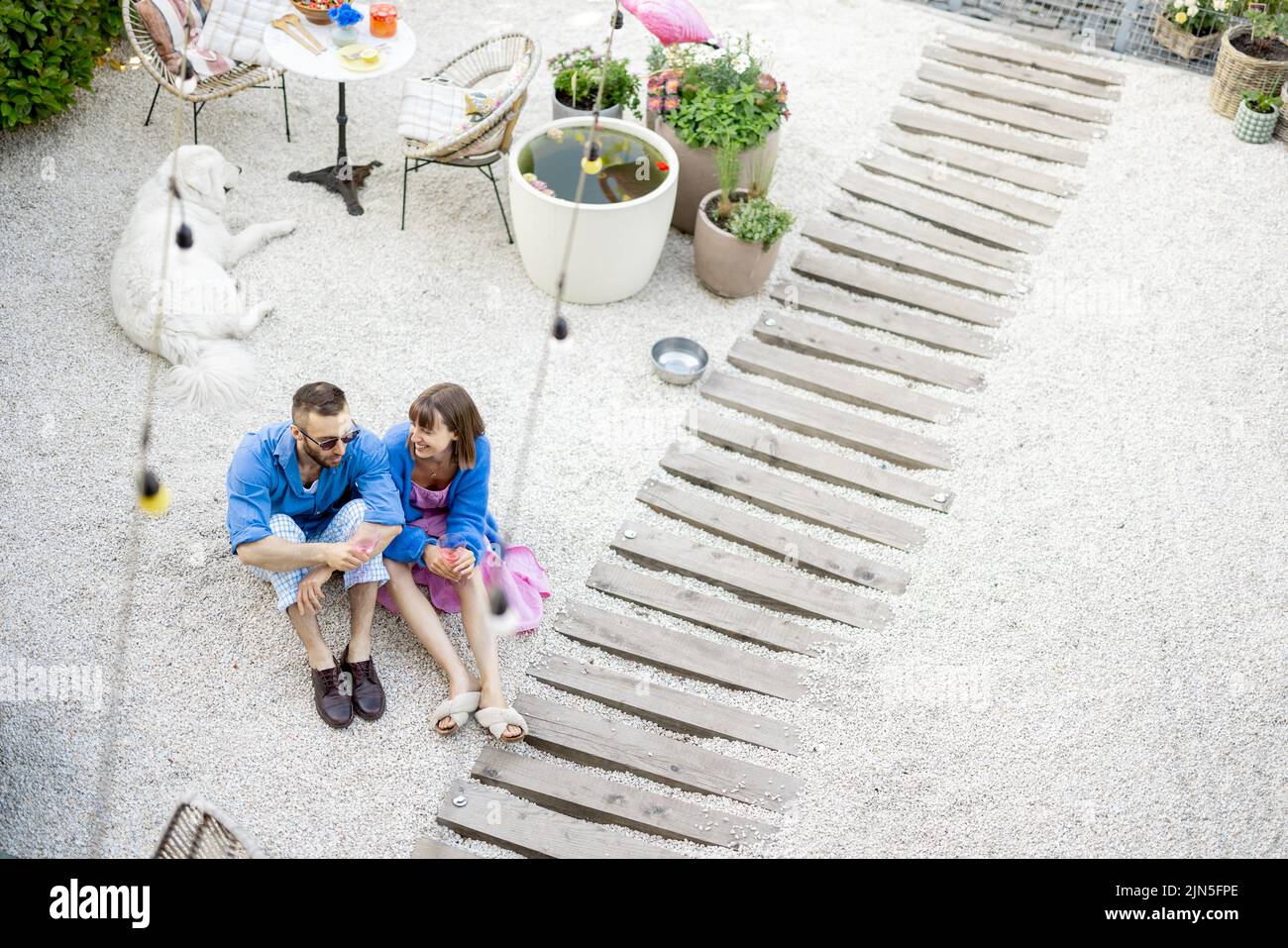 Couple at beautiful backyard Stock Photo - Alamy