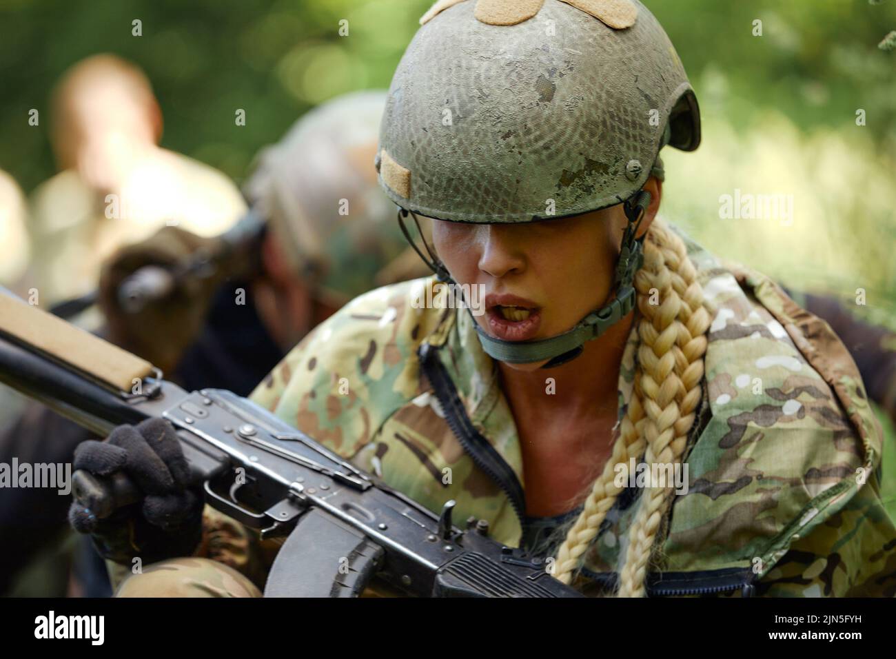 Caucasian Military lady woman in tactical gear posing for photo at ...