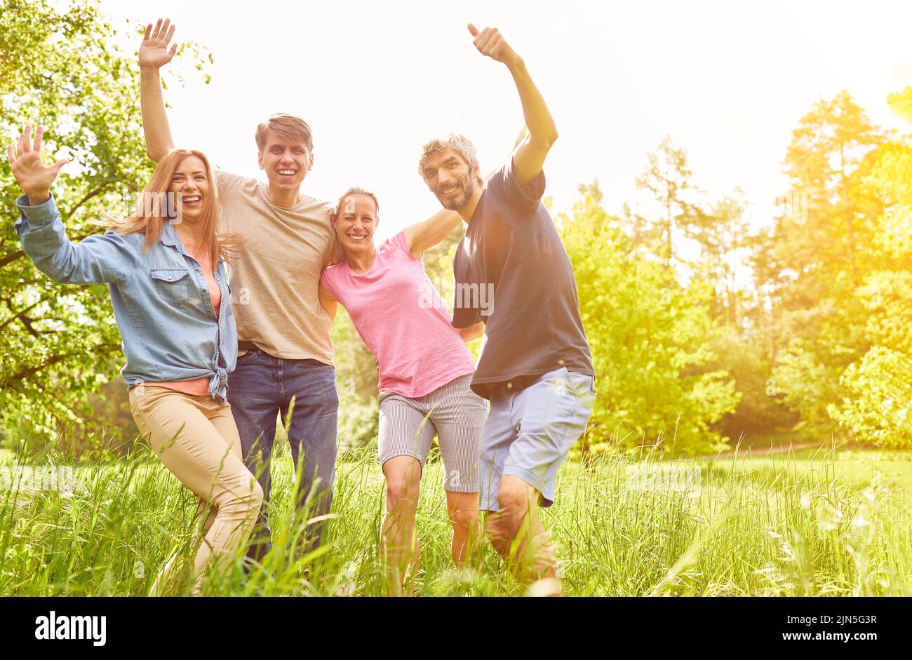 Happy family with adult children on hike in summer in nature Stock ...