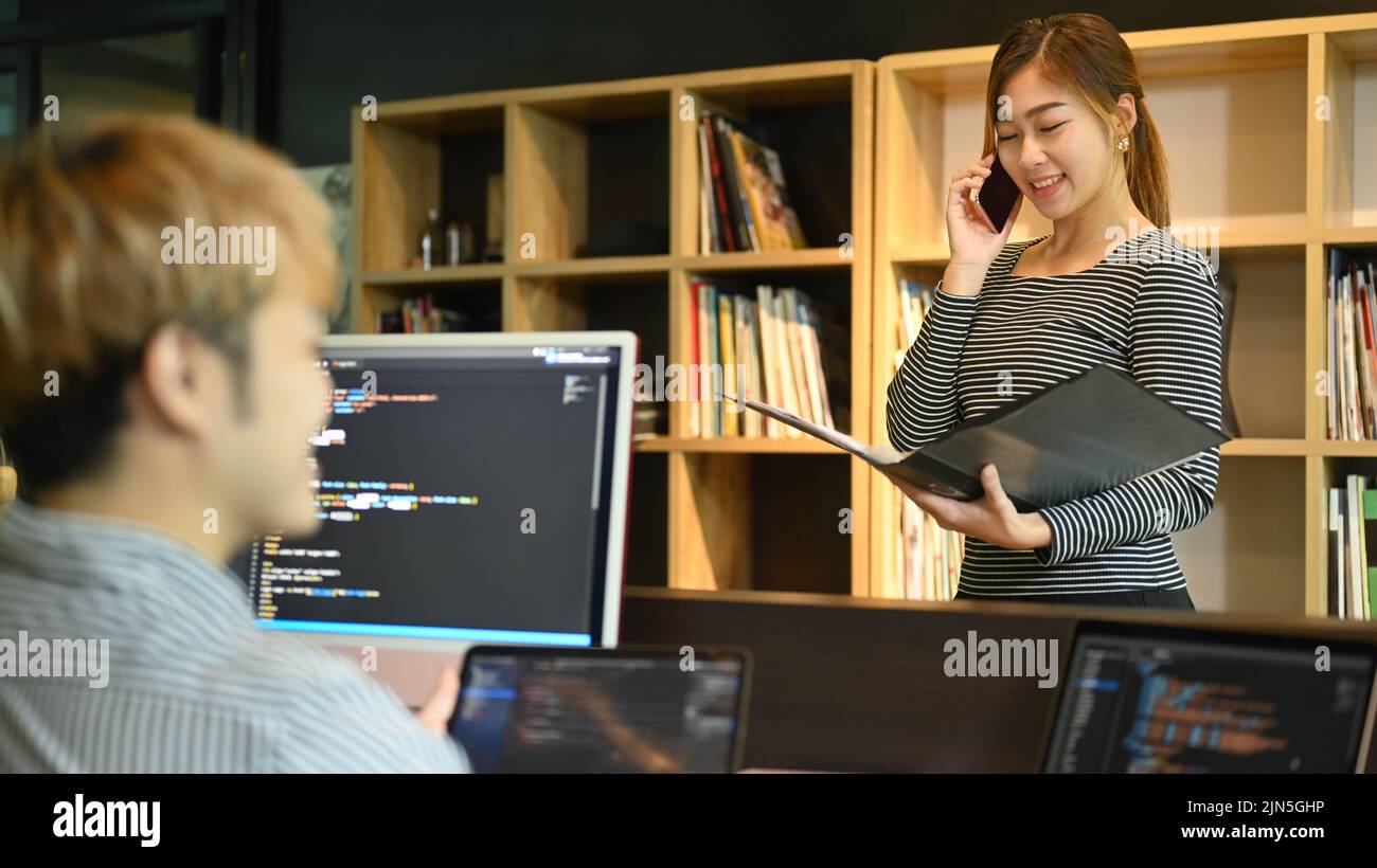 Young developers or coder team working together on software design ...