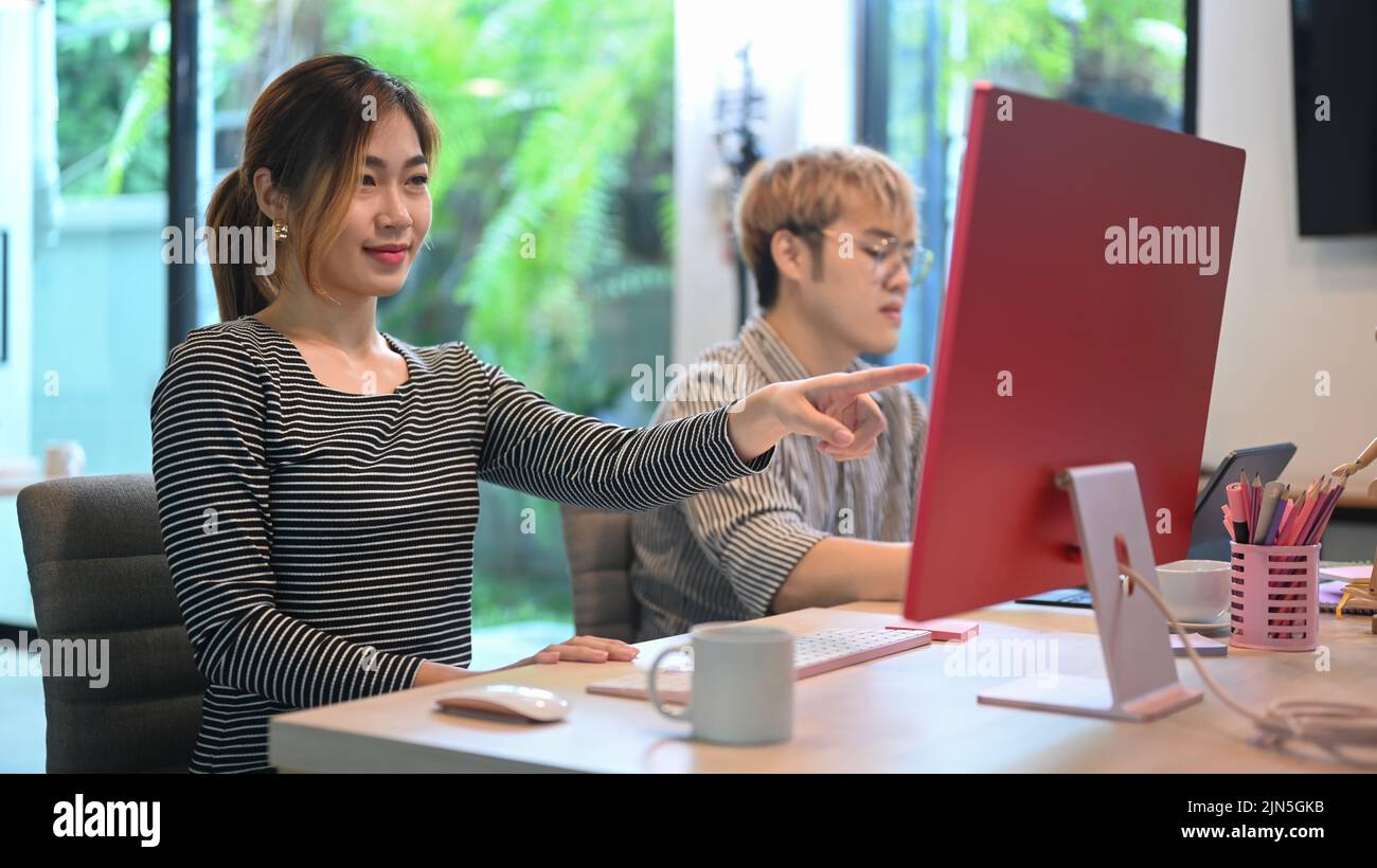 Professional Female Coding Programmers Working On Web Site Project In Corporate Office Stock