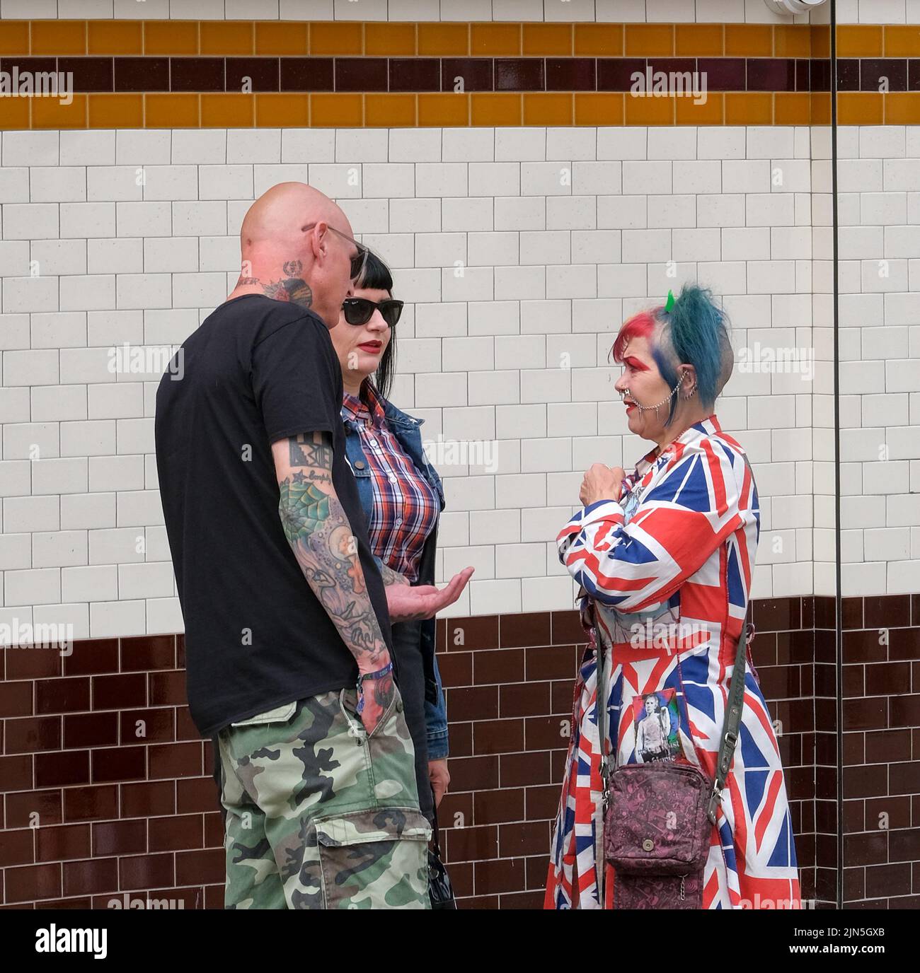 Blackpool, Lancashire, UK August 6 2022 3 punks in converstaion in ...