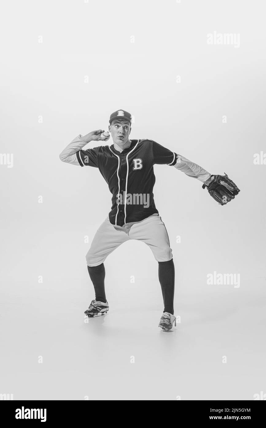 Portrait of concentrated man, college student, baseball player, pitcher ...