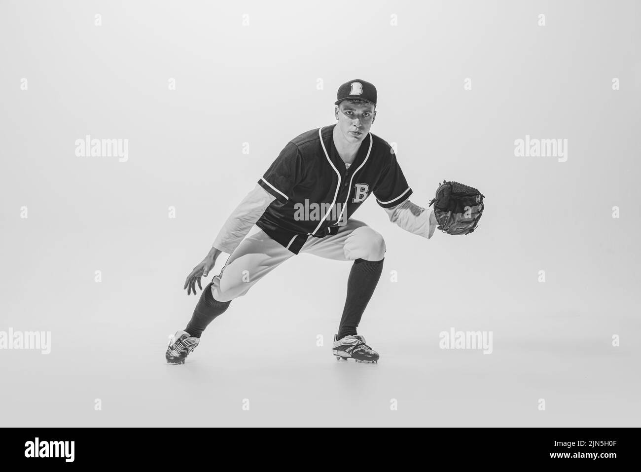 Portrait of young man, college student, baseball player, pitcher ...