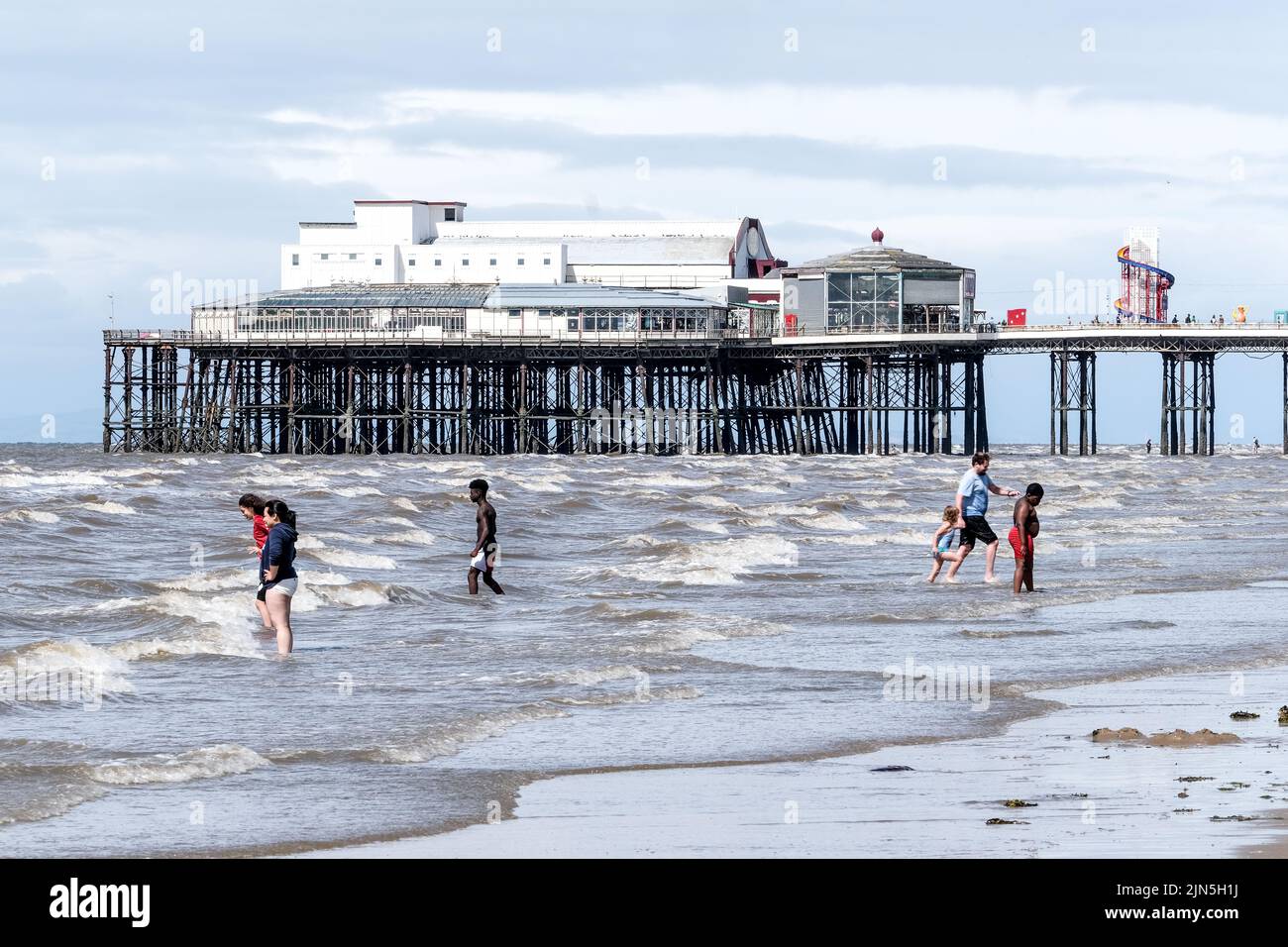 Blackpool, Lancashire, UK August 6 2022 Bathers enjoy the sea in front ...