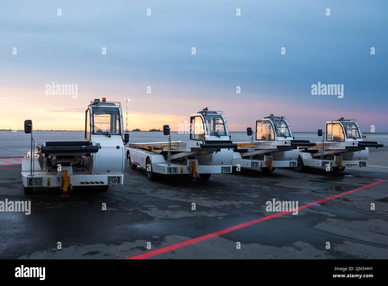 Airport self-propelled conveyor belt loaders at the evening Stock Photo ...