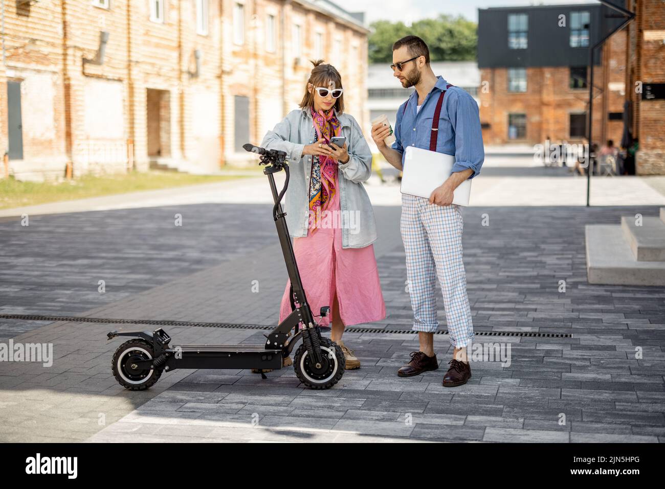Stylish colleagues meet together outdoors Stock Photo - Alamy