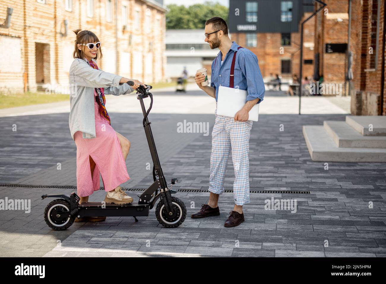 Stylish colleagues meet together outdoors Stock Photo - Alamy