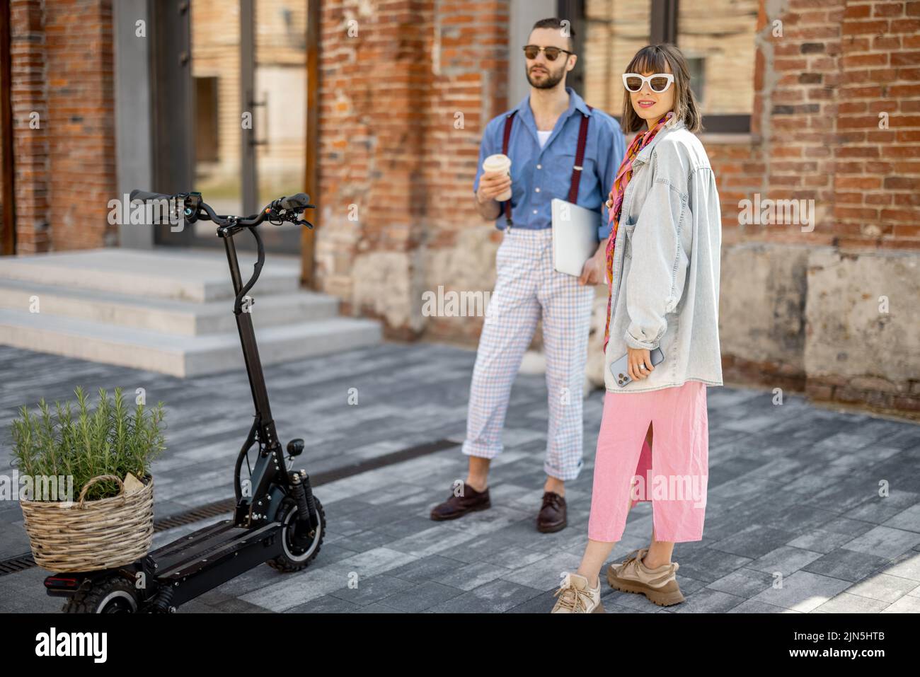 Stylish colleagues meet together outdoors Stock Photo - Alamy