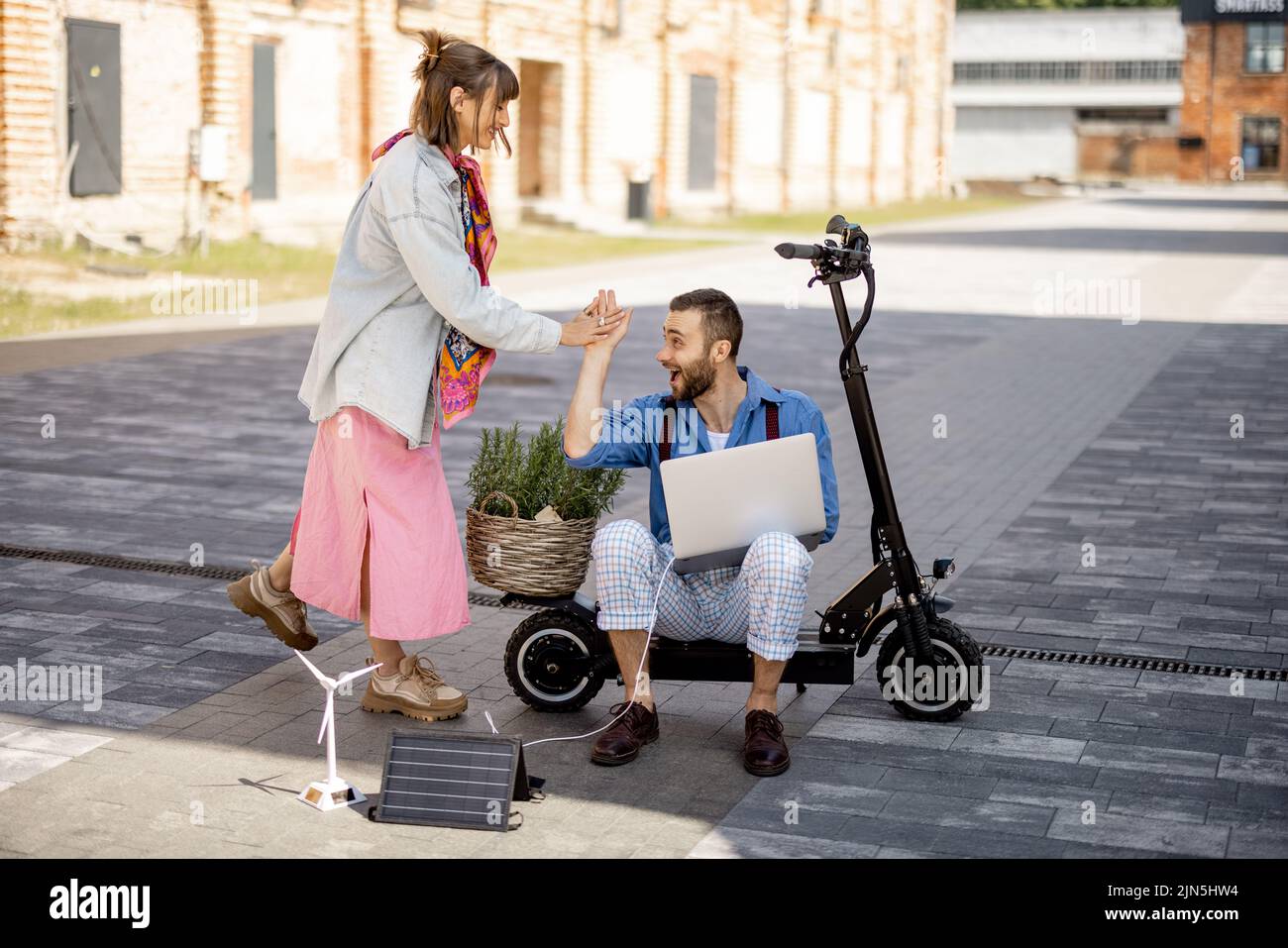 Stylish colleagues meet together outdoors Stock Photo - Alamy
