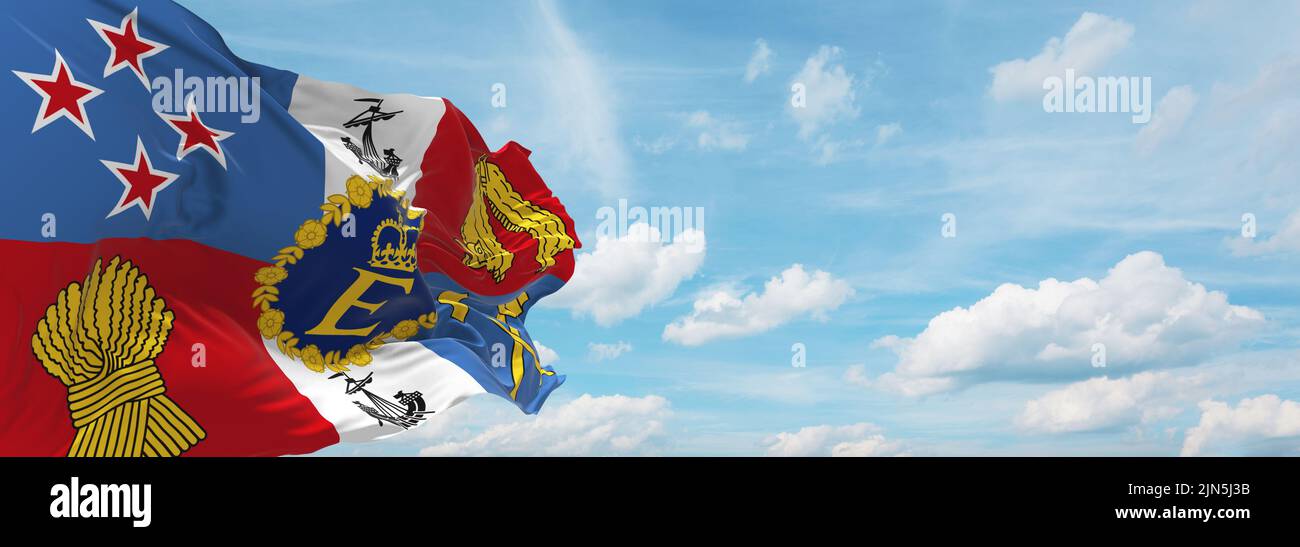 official flag of Royal Standard New Zealand at cloudy sky background on ...