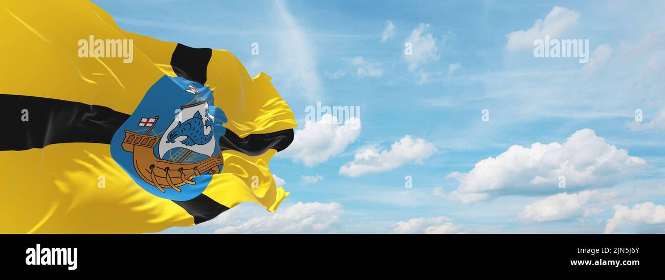 official flag of Wellington City New Zealand at cloudy sky background ...