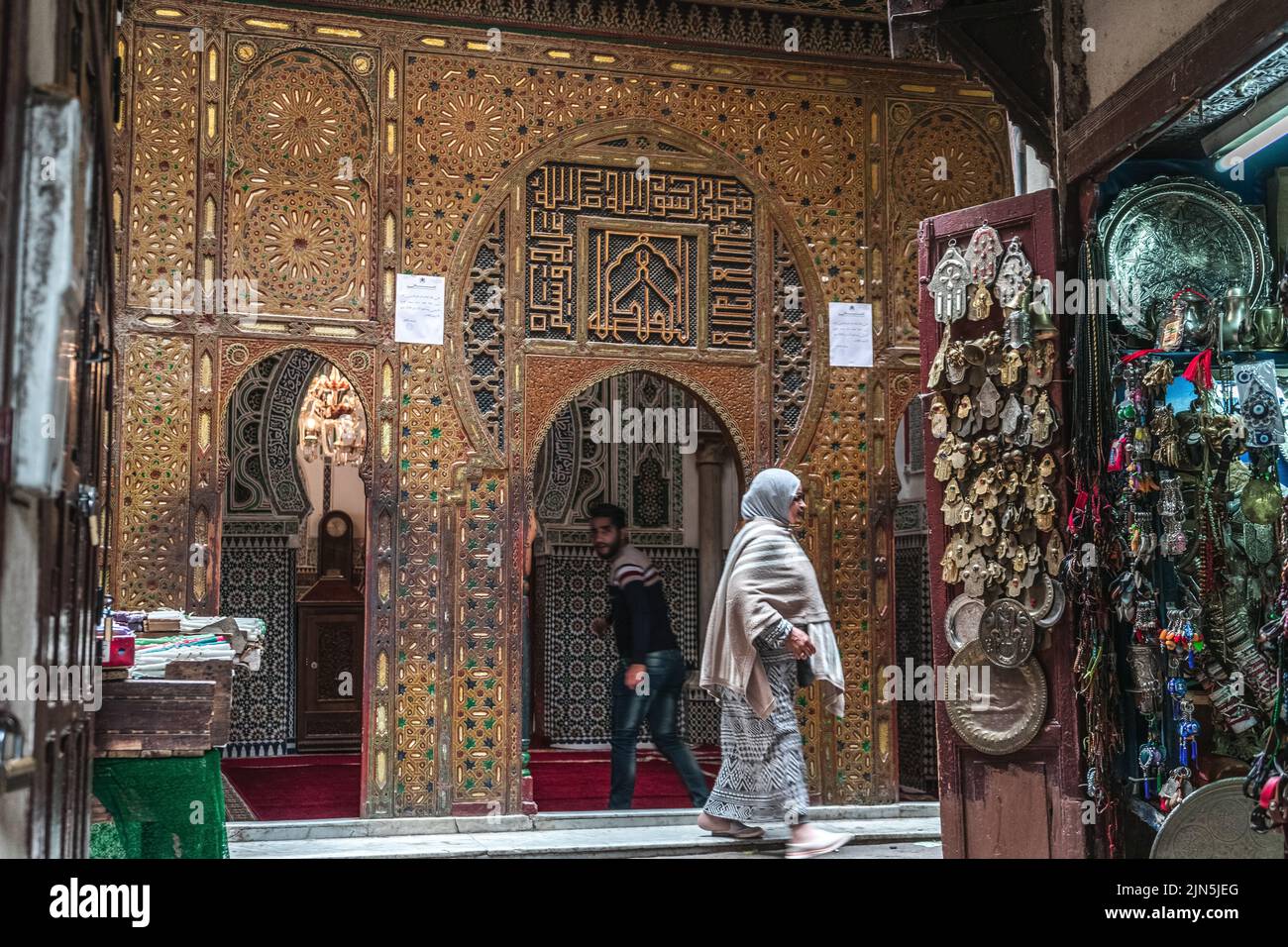 People walking nearby Zaouia Moulay Driss in the old Medina of Fes ...