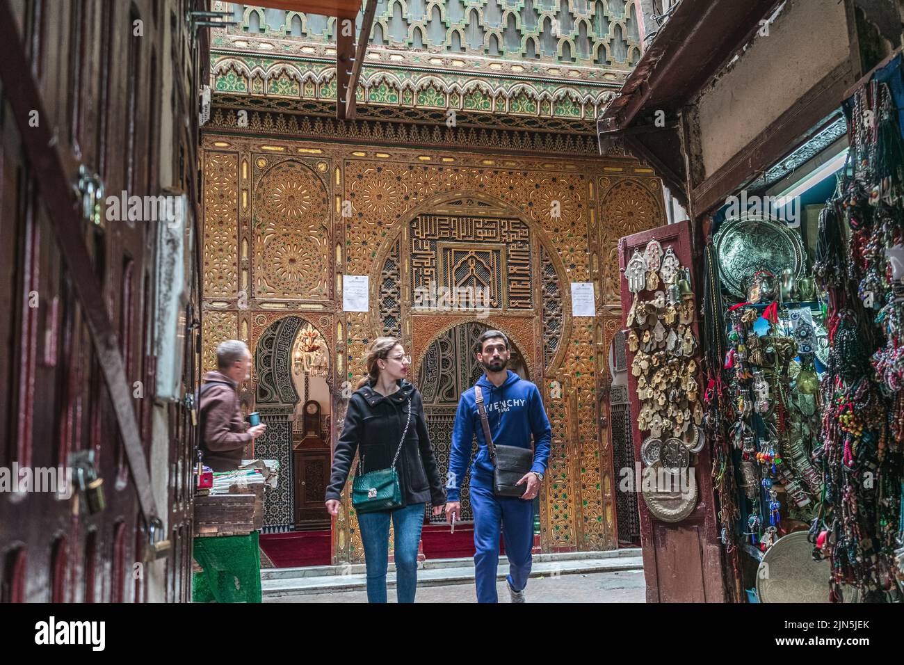 People walking nearby Zaouia Moulay Driss in the old Medina of Fes ...
