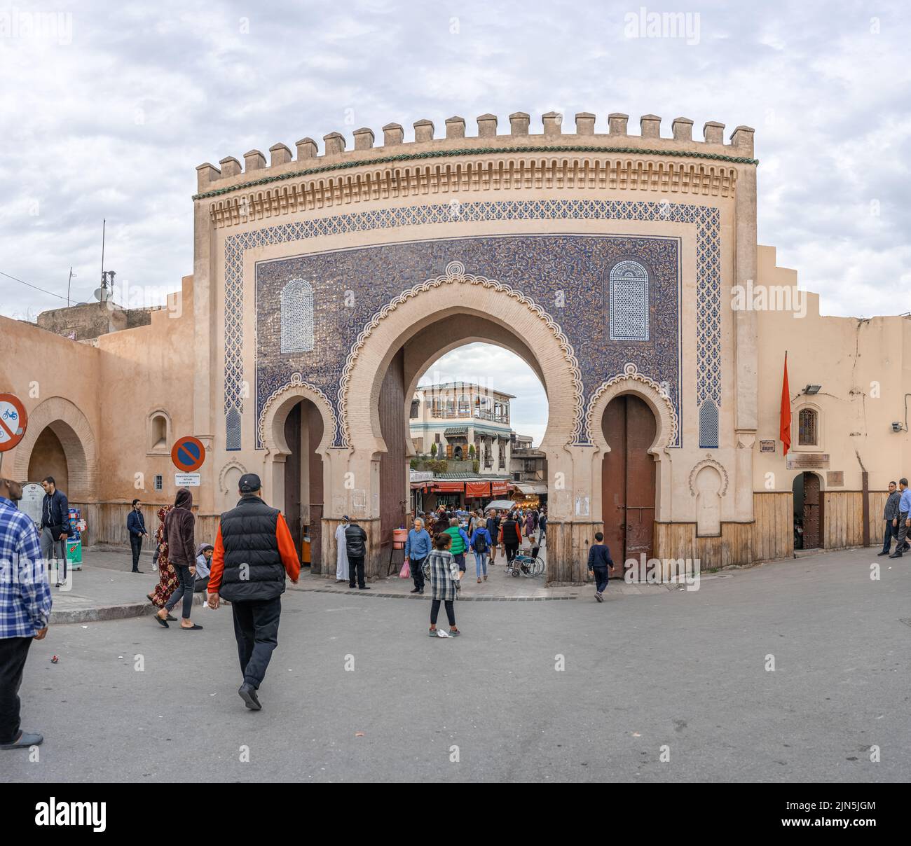 People walk by the Blue Gate in the old Medina of Fez Stock Photo - Alamy