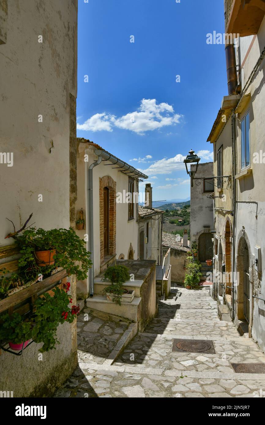 A small street between the old houses of Zungoli, one of the most ...