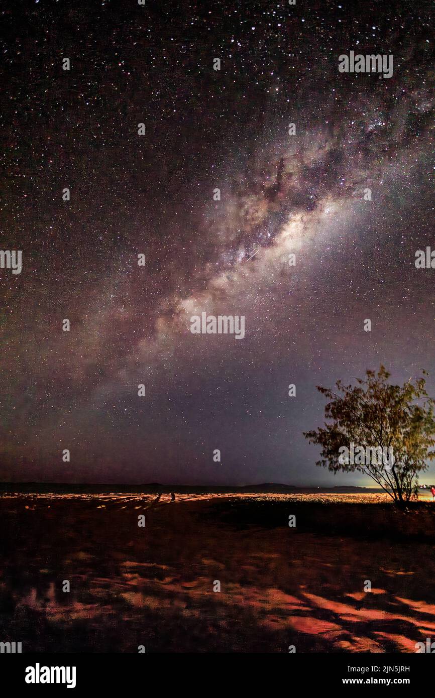 A vertical shot of the Milky Way galaxy and a desert at night Stock ...