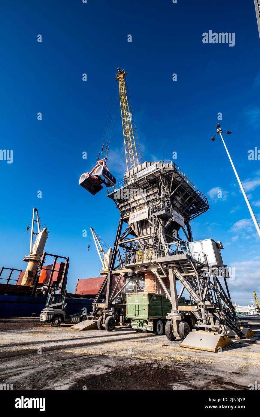 Grain being unloaded into a hopper at port Stock Photo - Alamy