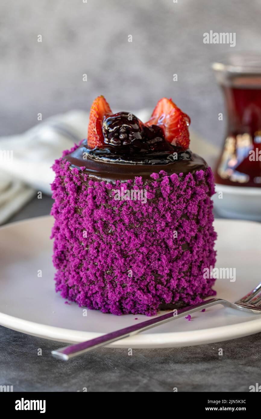 Fruit cake. Cake prepared with forest fruits on a plate. On dark ...