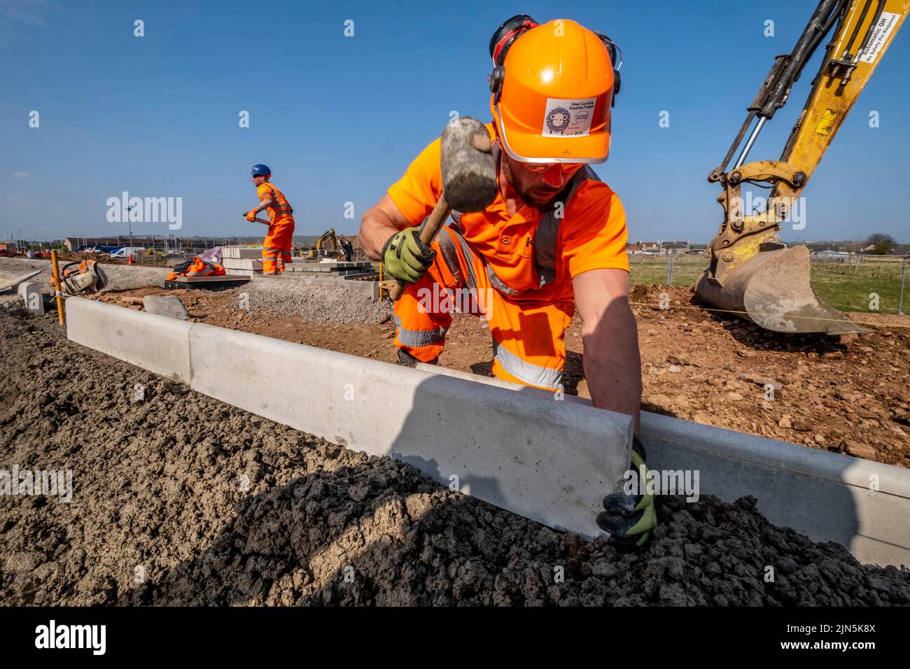 Railway workers building new railway and knocking down bridges Stock ...