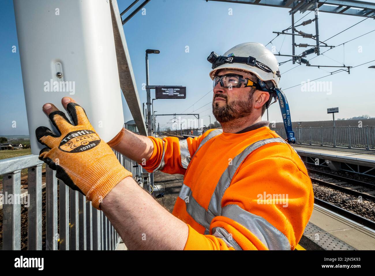 Railway workers building new railway and knocking down bridges Stock ...