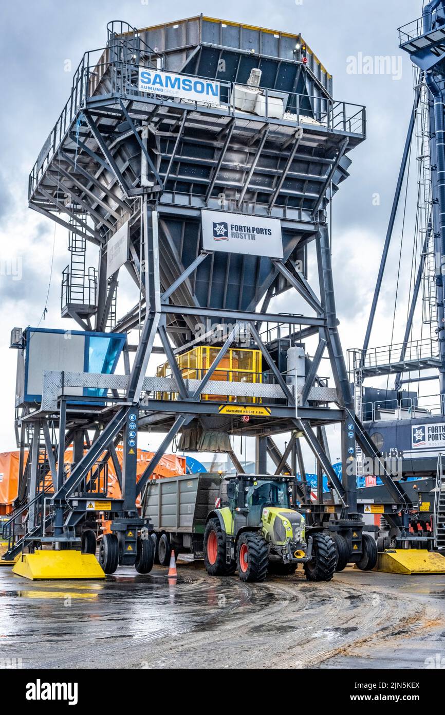 Grain being unloaded into a hopper at port Stock Photo - Alamy