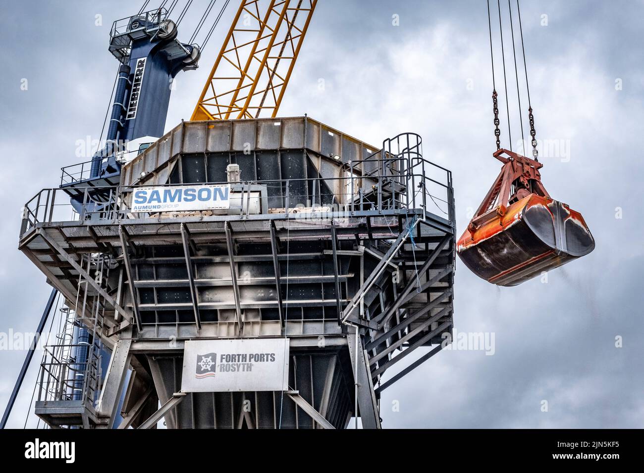 Grain being unloaded into a hopper at port Stock Photo - Alamy