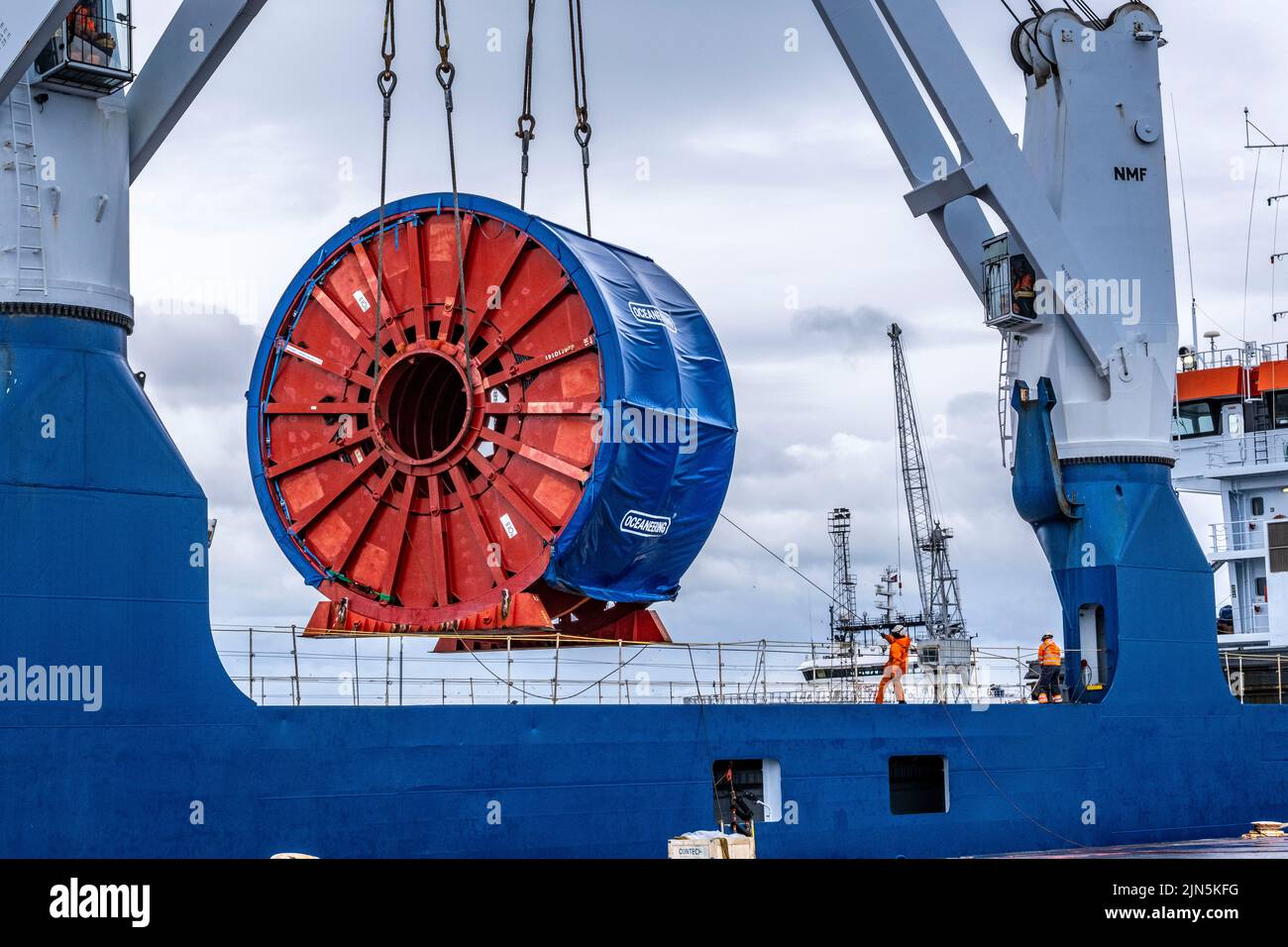 Giant Reels being loaded onto a tanker in port Stock Photo - Alamy
