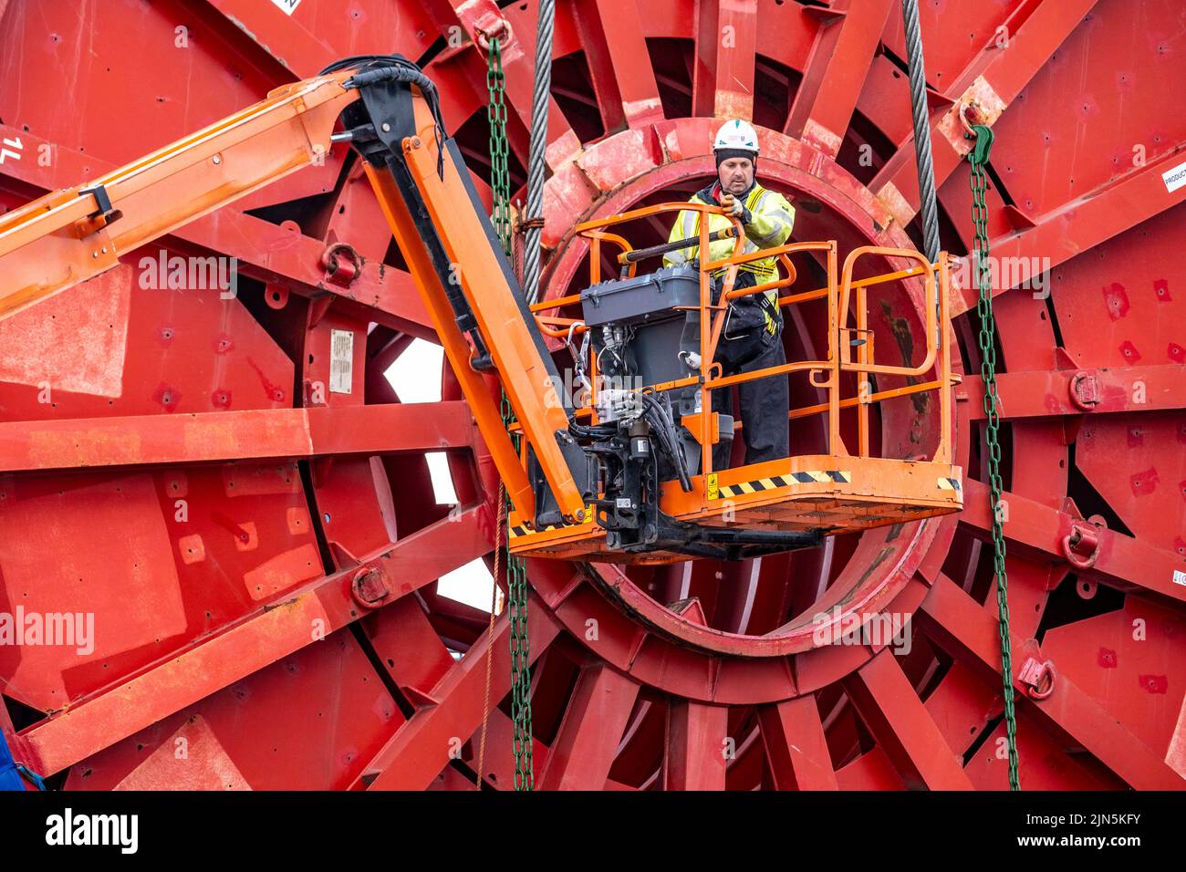 Giant Reels being loaded onto a tanker in port Stock Photo - Alamy