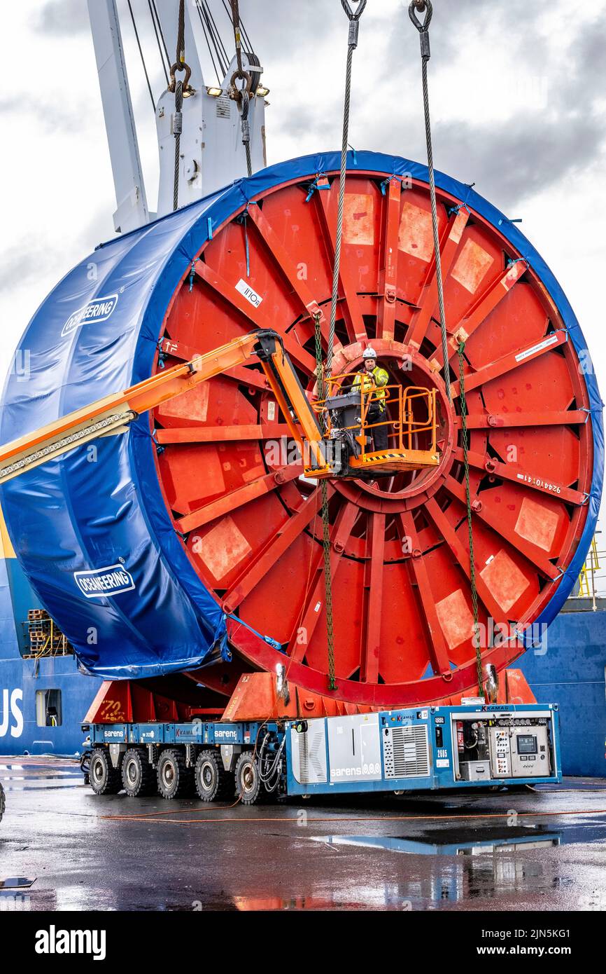 Giant Reels being loaded onto a tanker in port Stock Photo - Alamy