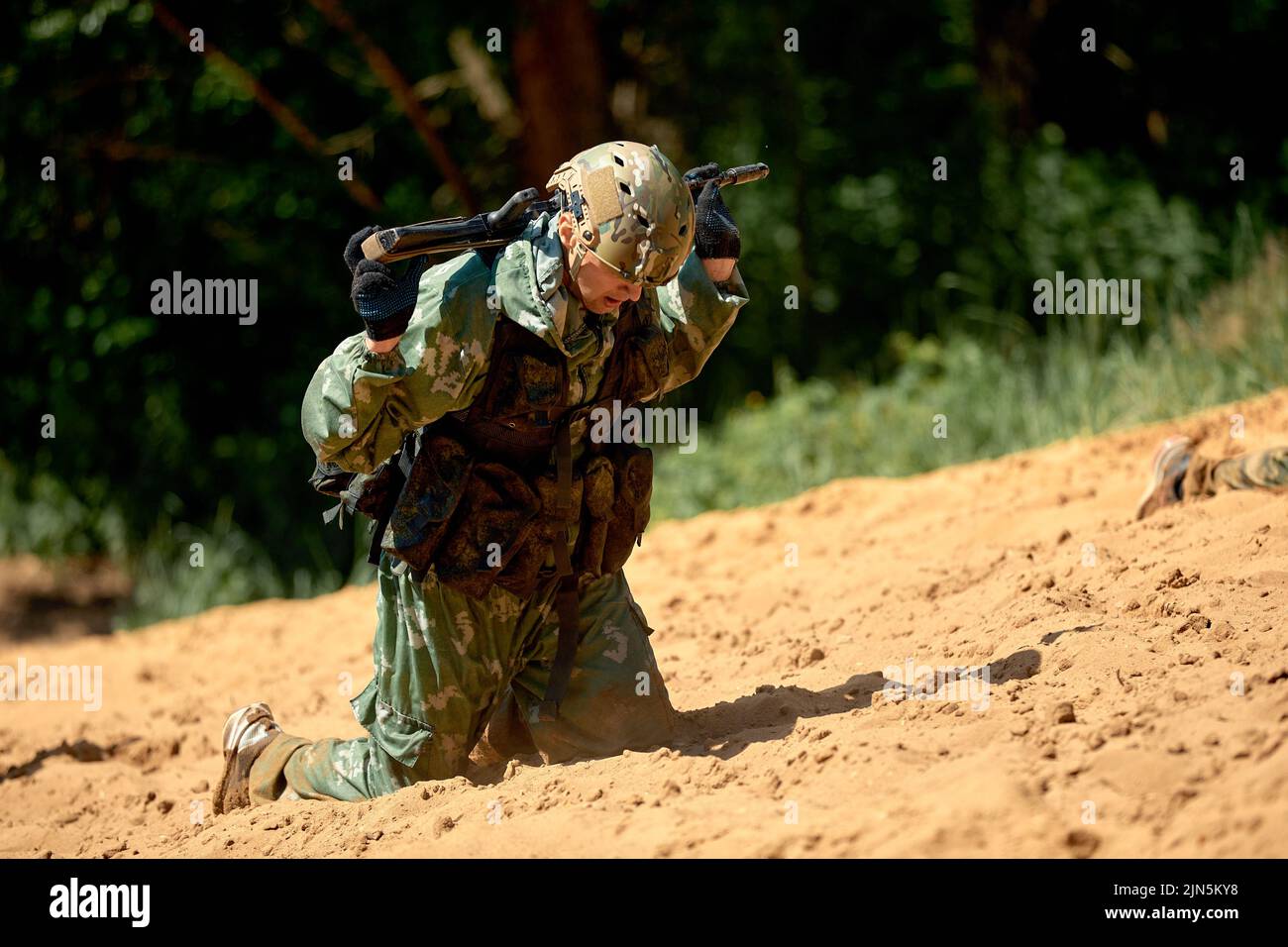 Special forces soldier with weapon take part in military maneuver. War ...