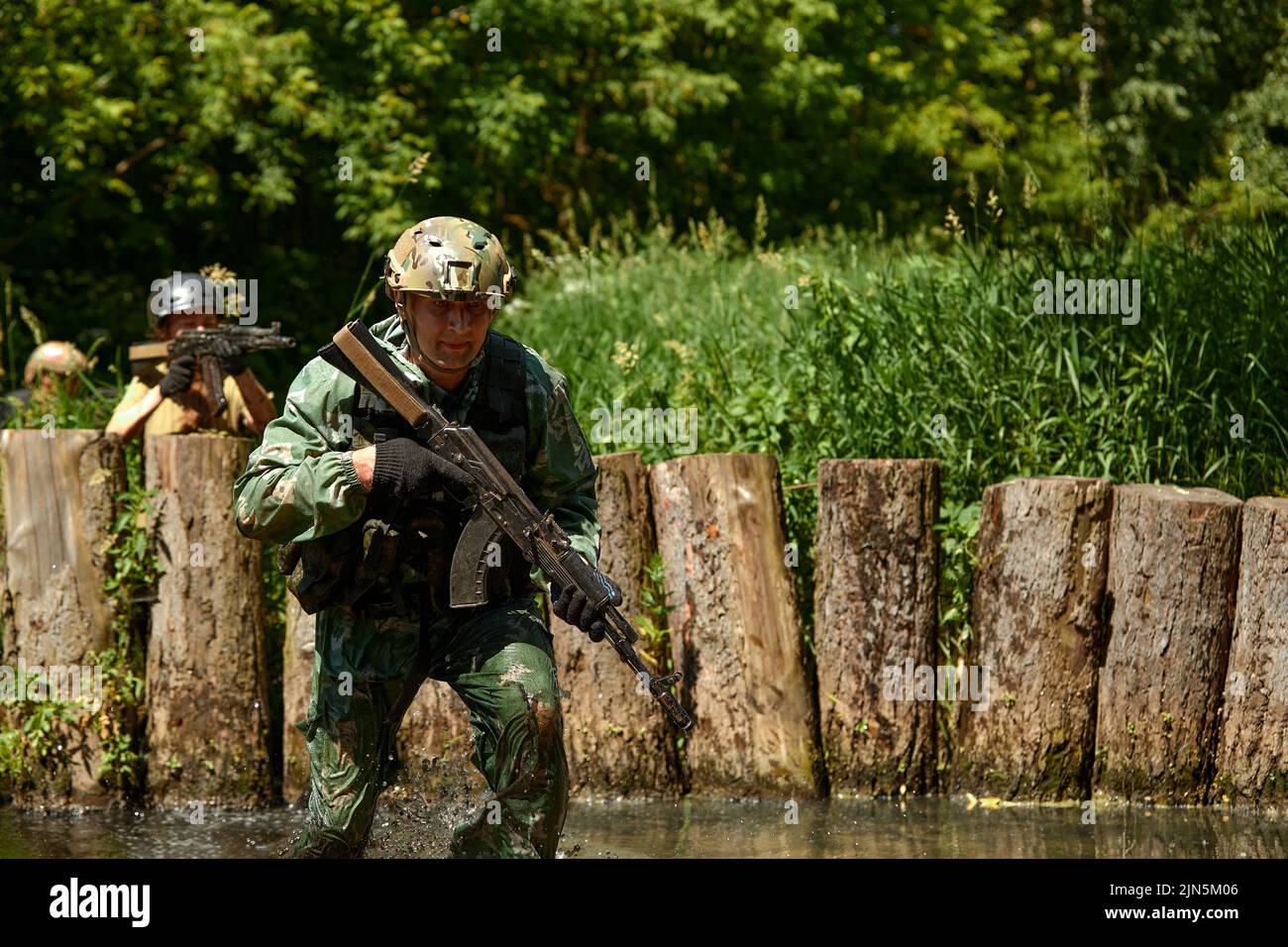 Soldiers game on military training ground battle camp. Action ...