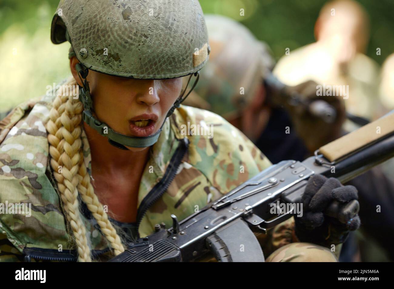 Caucasian Military lady woman in tactical gear posing for photo at ...