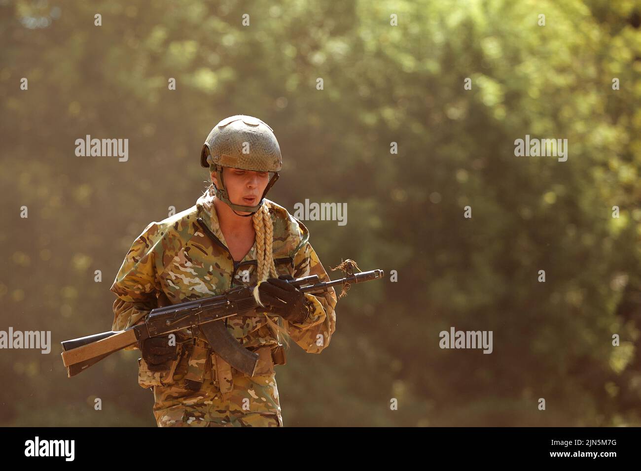 Caucasian Military lady woman in tactical gear posing for photo at ...