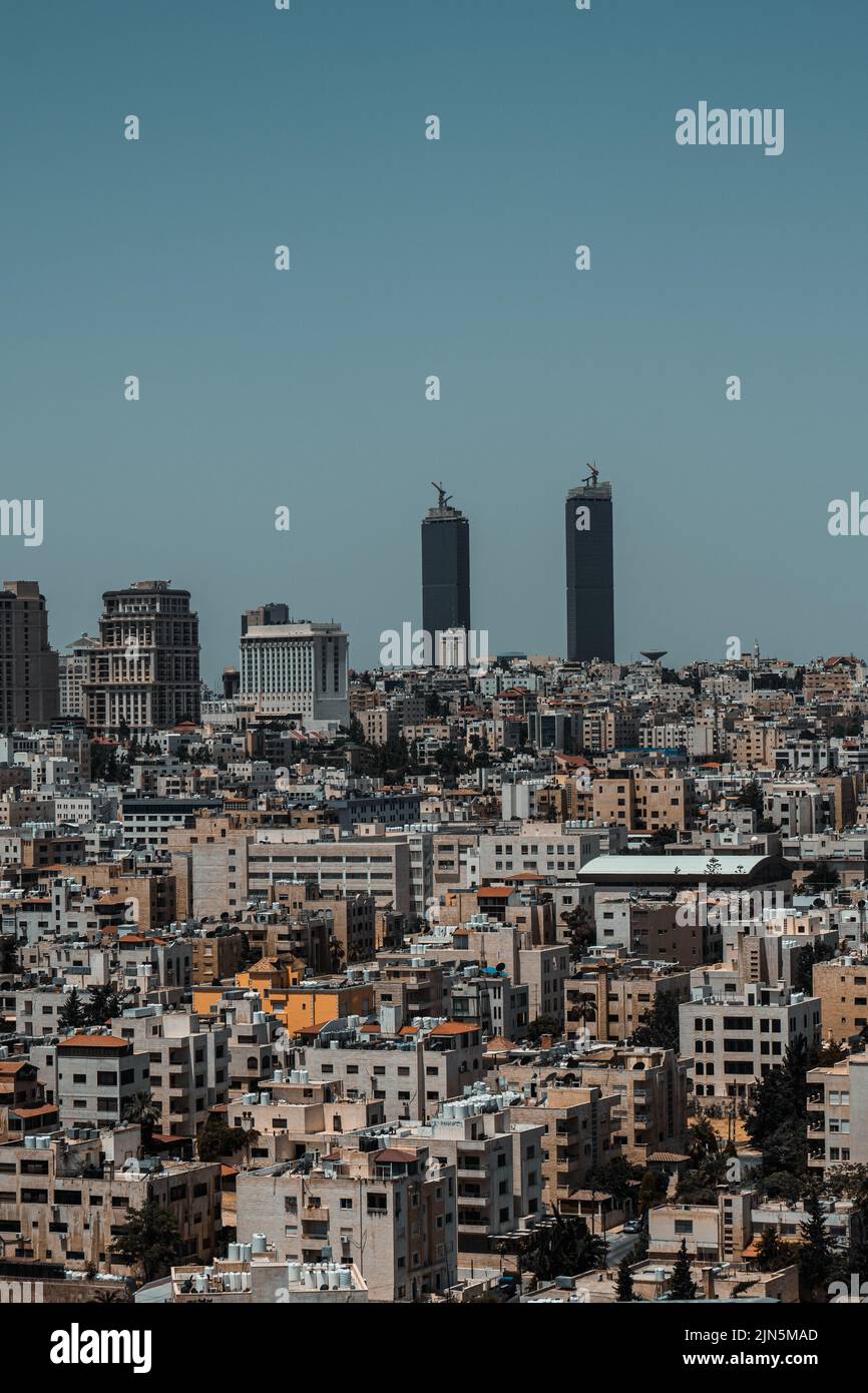 A vertical aerial view of the buildings of Amman during a cloudy day in ...