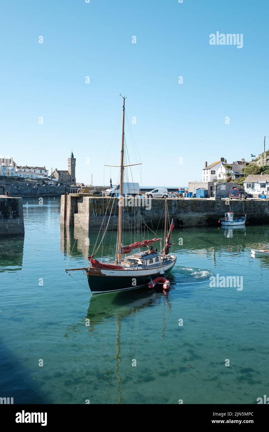 A beautiful ketch leaves Porthleven harbour Stock Photo - Alamy