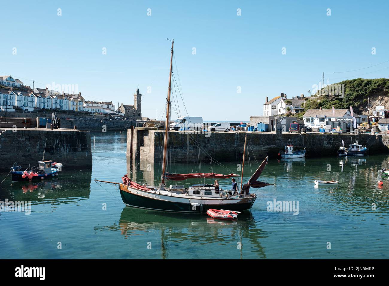 A beautiful ketch leaves Porthleven harbour Stock Photo - Alamy