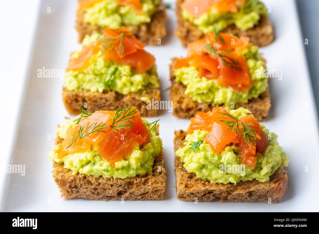 Avocado and salmon on rye bread hi-res stock photography and images - Alamy