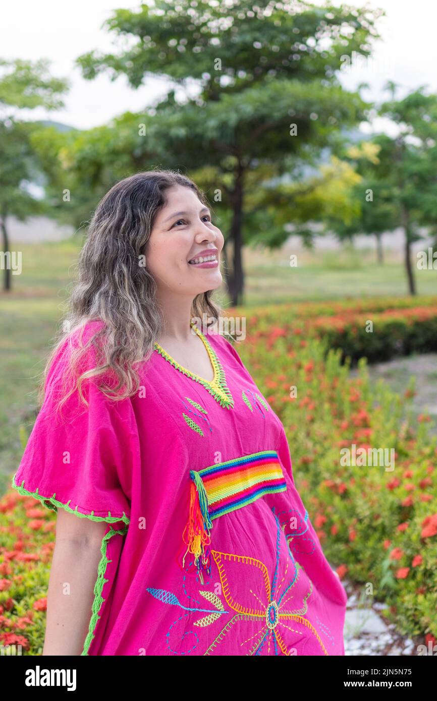 young indigenous woman standing in a park Stock Photo - Alamy
