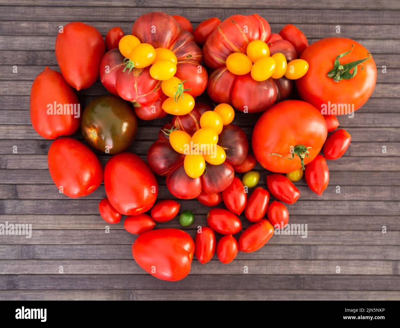 different varieties of ripe red and yellow appetizing tomatoes Stock ...