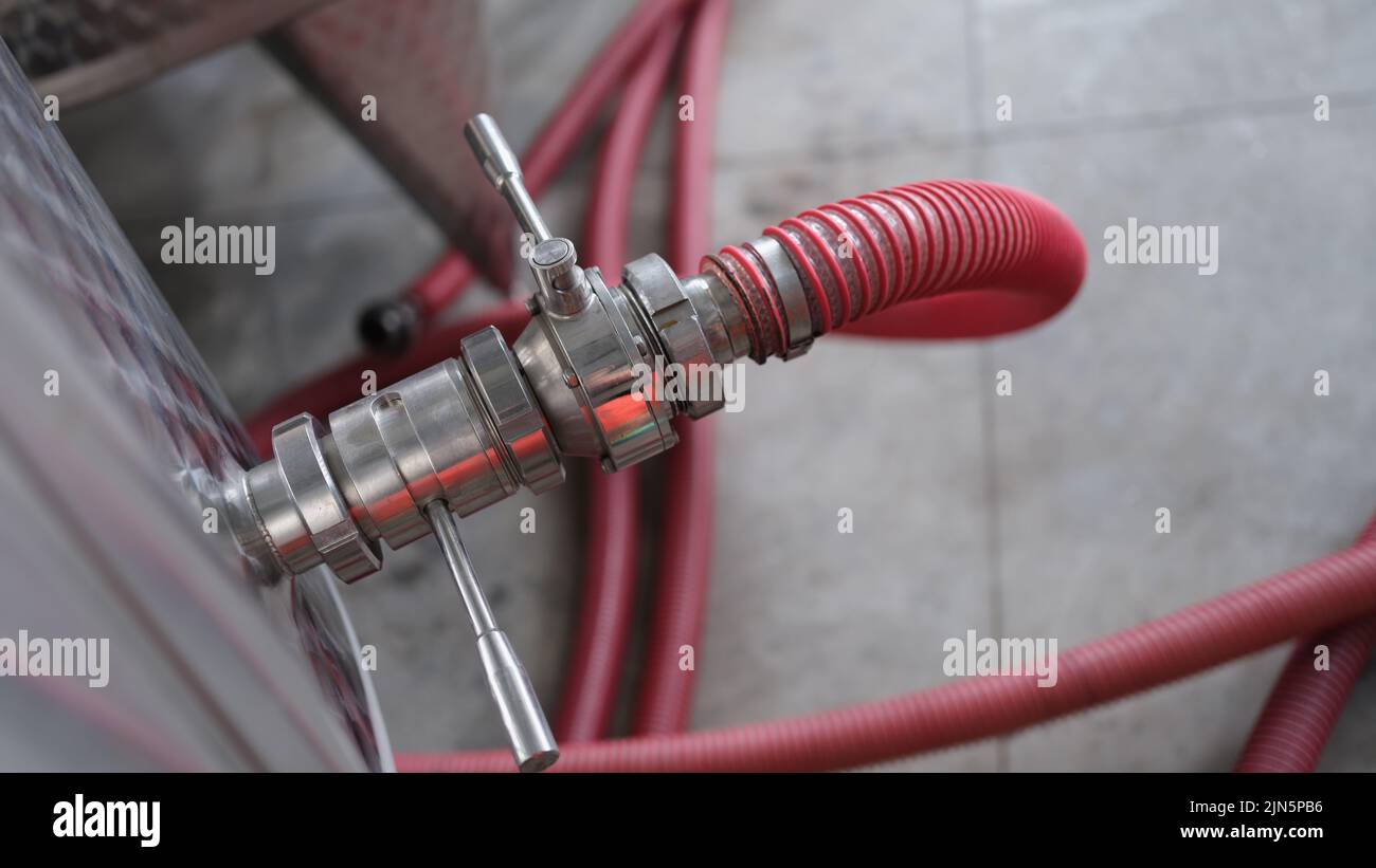 Industrial stainless steel pipe equipment with faucet and hose in wine ...