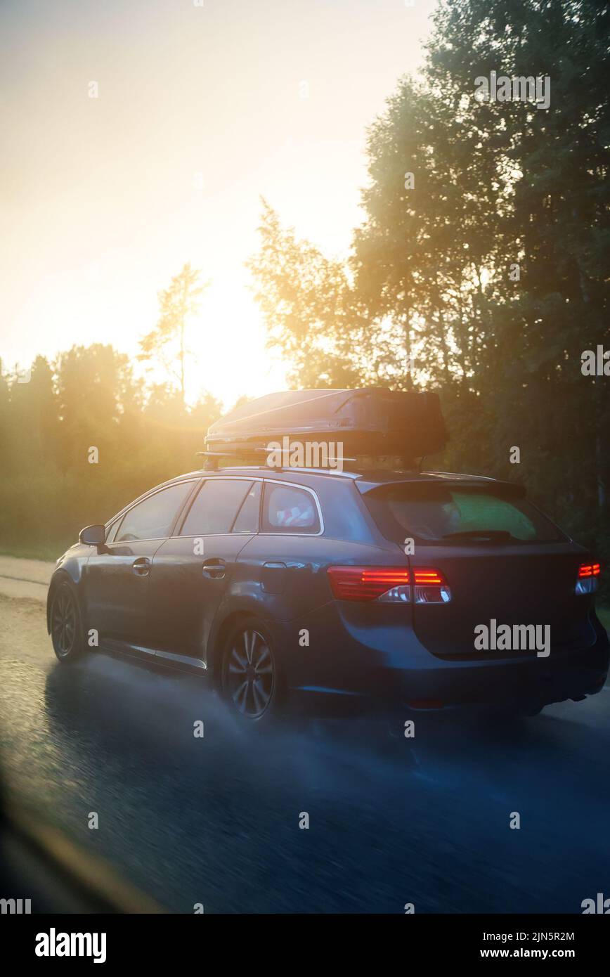 Car going on the road after the rain Stock Photo - Alamy
