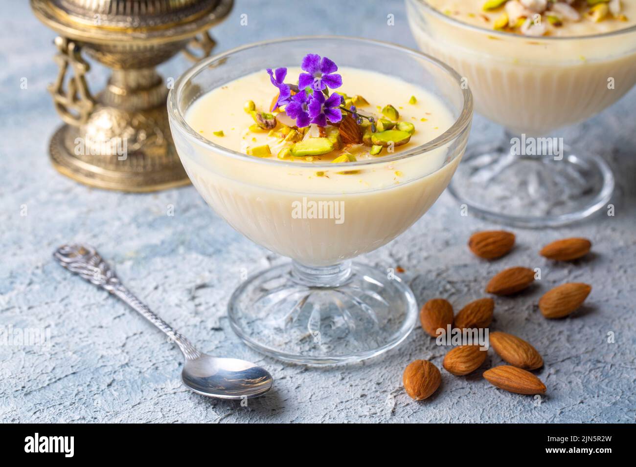 Traditional delicious Turkish Desserts; Keskul - Pudding Stock Photo ...