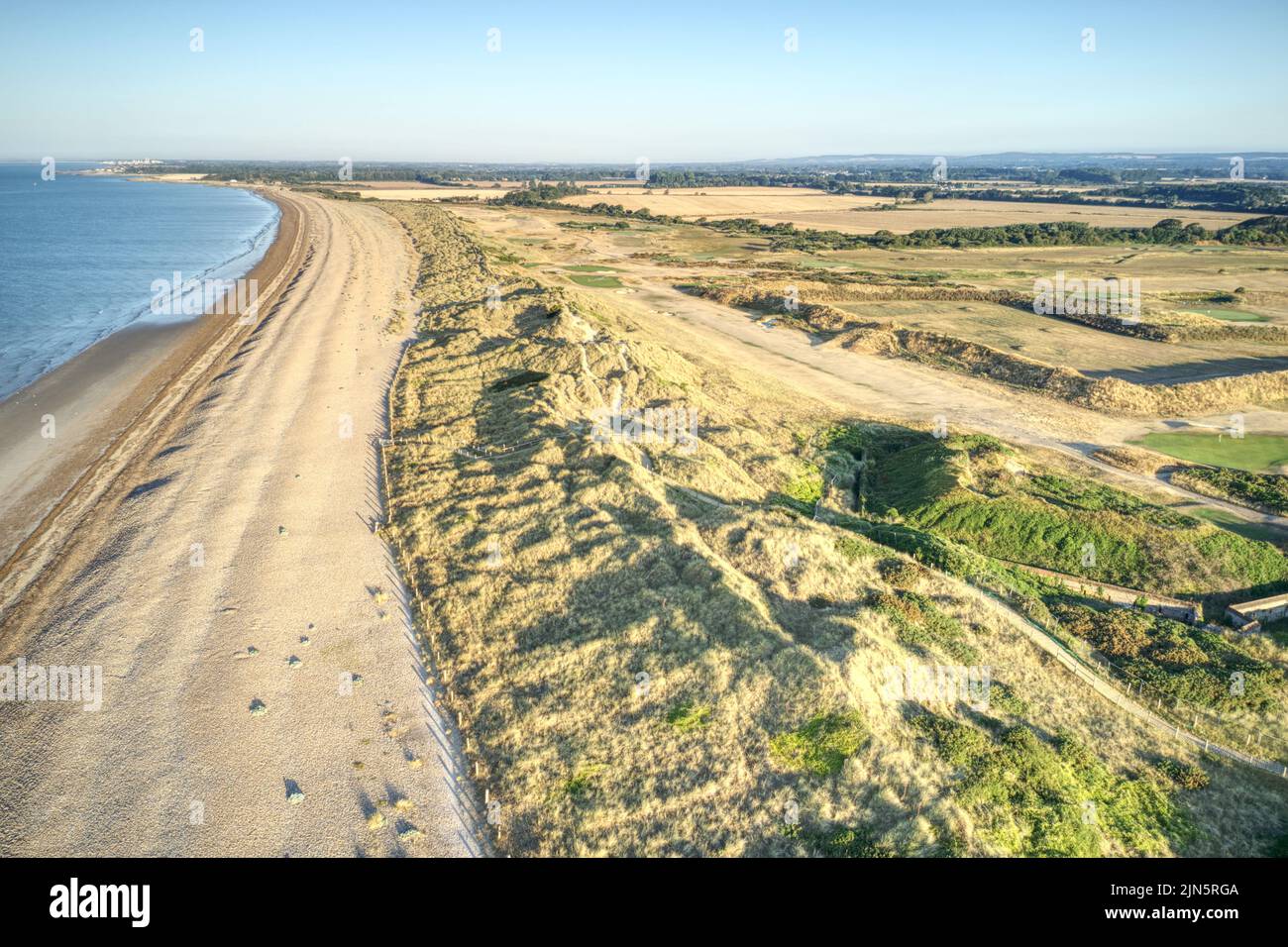 Aerial photo over the sand dunes that protect the Littlehampton golf ...